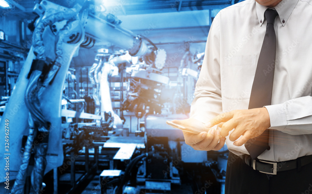 Man hand holding tablet or controller with automate wireless Robot arm ...