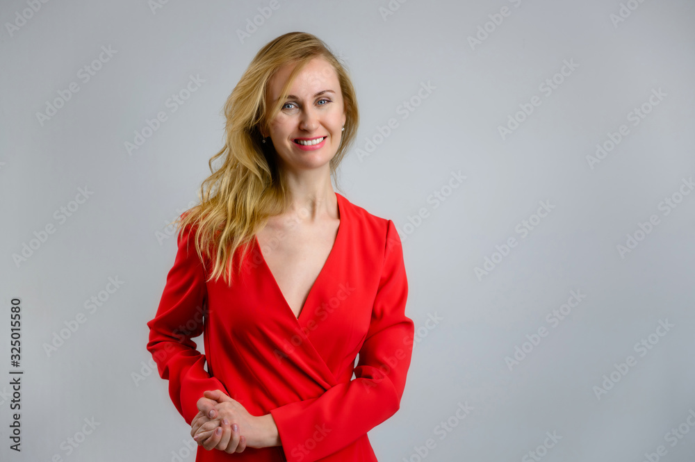 Portrait of a beautiful woman 38 years old blonde on a white background ...