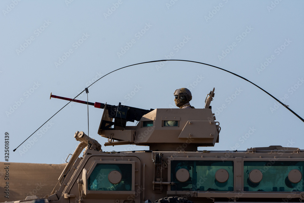 Military tank army vehicle close up of guns and military personel ...