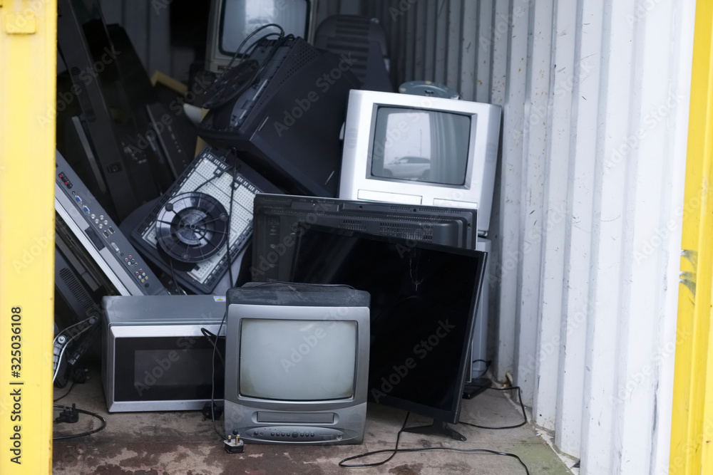 Old television tv monitors pc computer screens at refuse dump skip ...