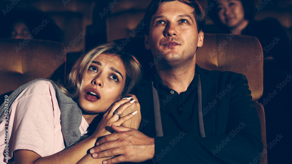 People audience watching movie in the movie theater cinema. Group ...