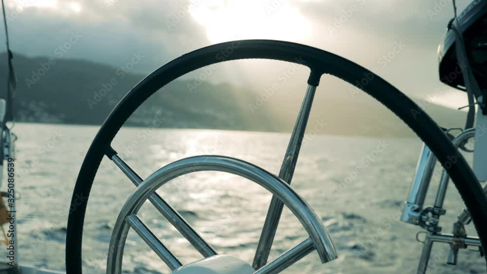 Black helm on a yacht in sea. Stock Video | Adobe Stock