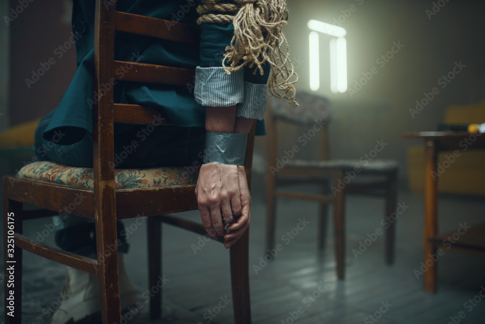 Female victim of maniac kidnapper with taped hands Stock Photo | Adobe ...
