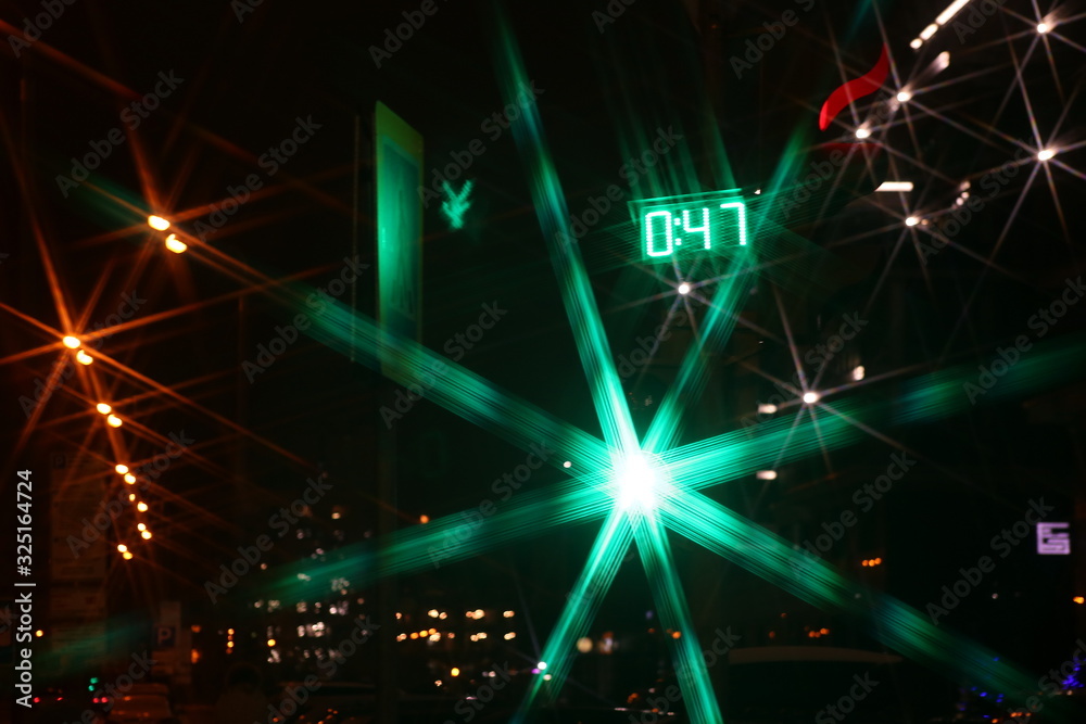 Green traffic light for pedestrians in the night city. Road signs. Road ...