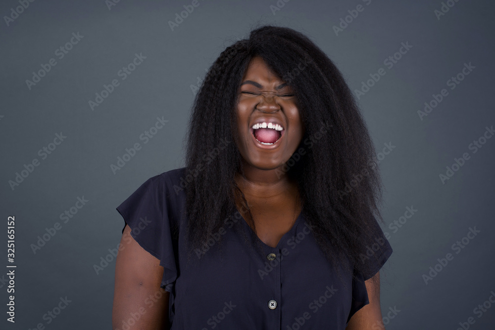 Stressful African American woman screams in panic, closes eyes in ...