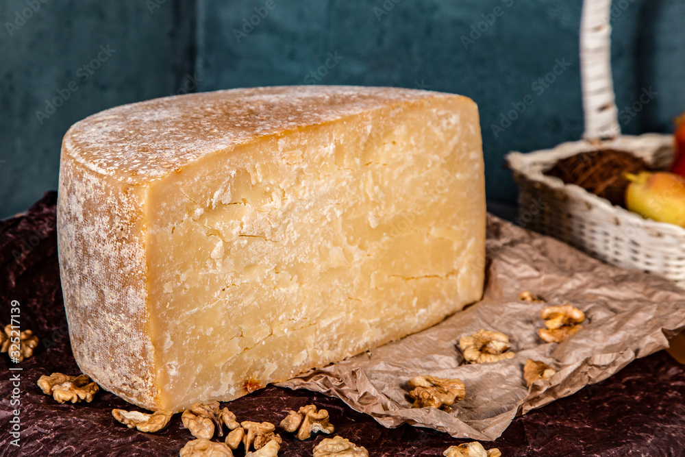 Big yellow part of goat cheese heads on a blue background. Stock Photo ...
