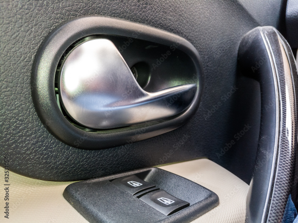 Modern luxury car door lock buttons and door open handle Stock Photo ...