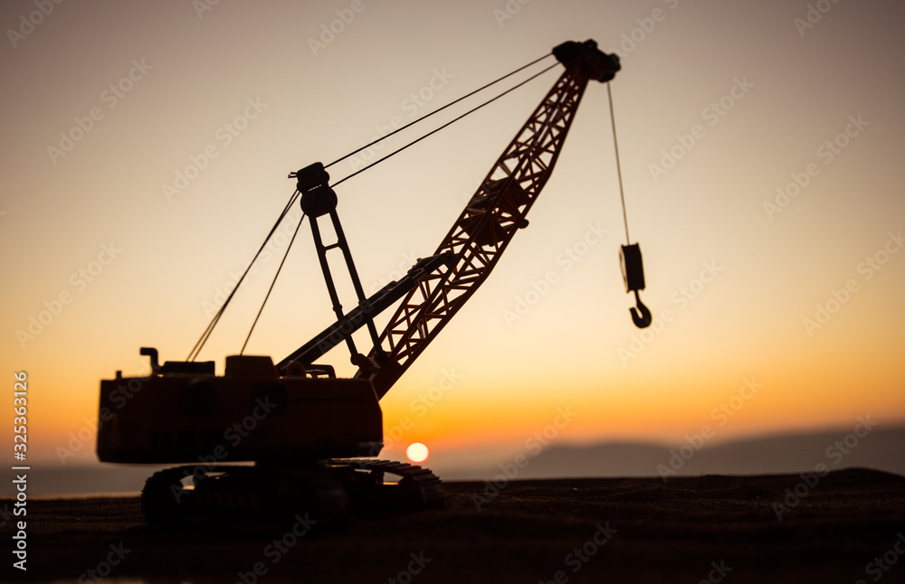 Abstract Industrial background with construction crane silhouette over ...
