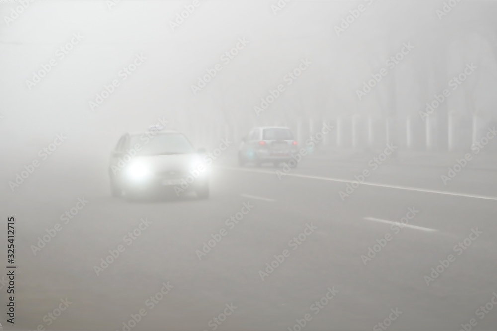 Fog weather and highway in city. Car Driving in Dense Fog. Dangerous ...