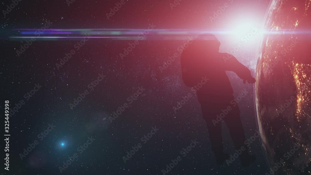 Astronaut man silhouette against realistic Earth. Back view of spaceman ...