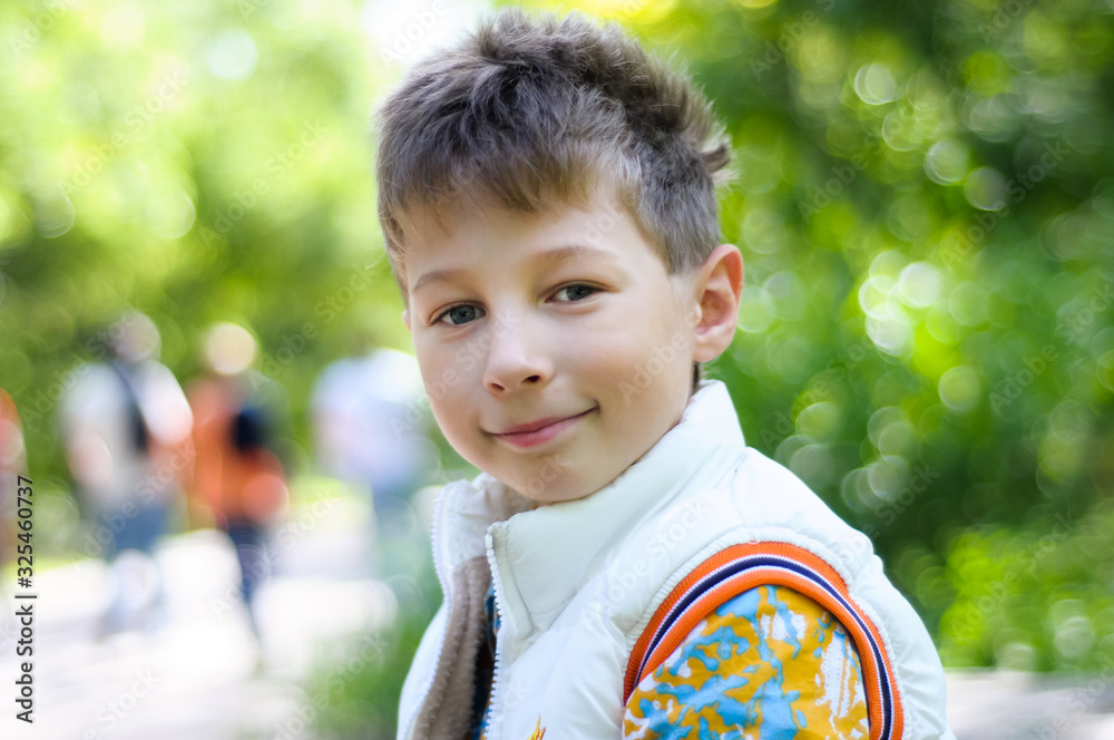 Handsome young boy portrait. Smiling kid boy looking at camera on the ...