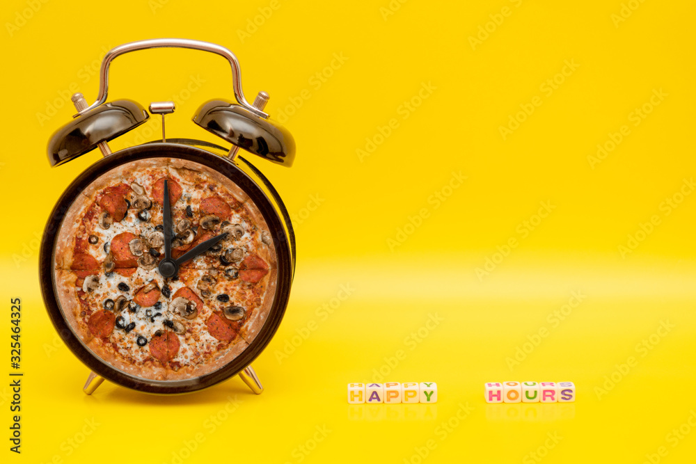 Alarm clock with pizza dial on yellow background with words "Happy ...