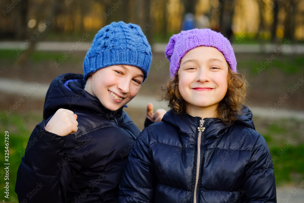 Brother and sister play, laugh, fool around and make grimaces and funny ...