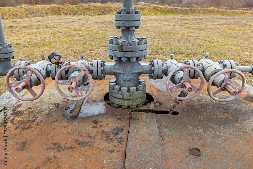 Working oil well, oil pipeline crane. production wellhead. Offshore the ...