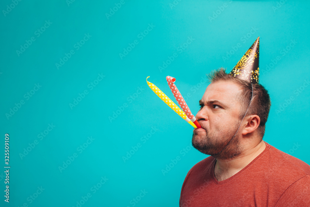 Funny portrait of fat man who is celebrating his birthday, wearing ...