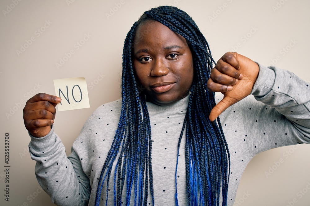 Young african american plus size woman with braids holding reminder ...