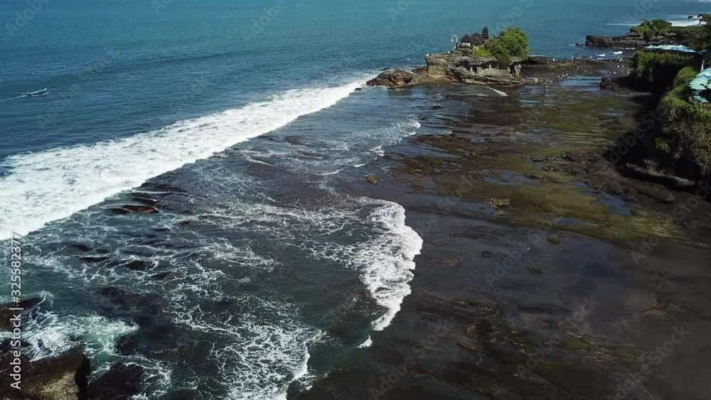 DJI Drone footage of the ocean and Tanah Lot Temple area in Beraban ...