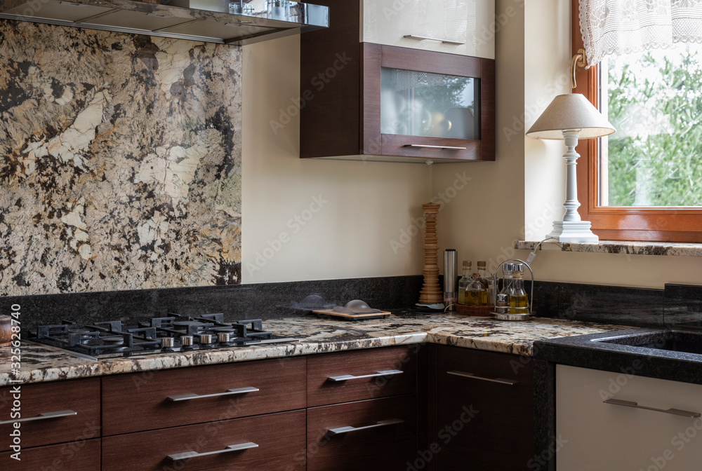 Marble kitchen interior with brown wooden furniture and window. Beige ...