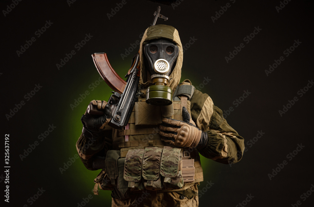 soldier Stalker saboteur in military uniform with a Kalashnikov rifle ...