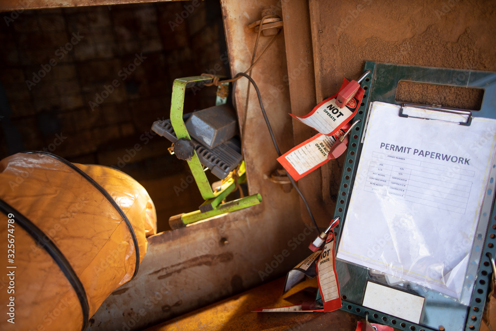 Safe workplace permit to work paper clipping on isolation control ...