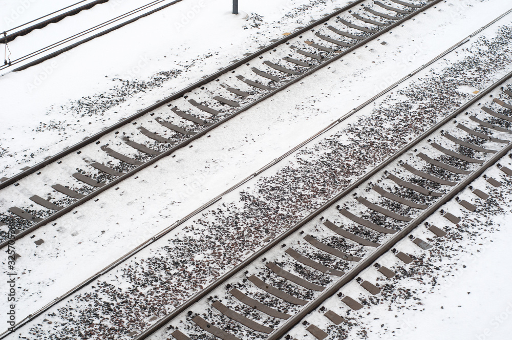 snow covered railway rails. road for the carriage of freight cars ...