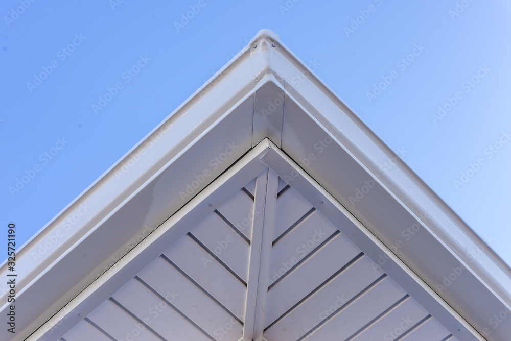 Colonial white soffit provides optimal ventilation for roof overhangs ...