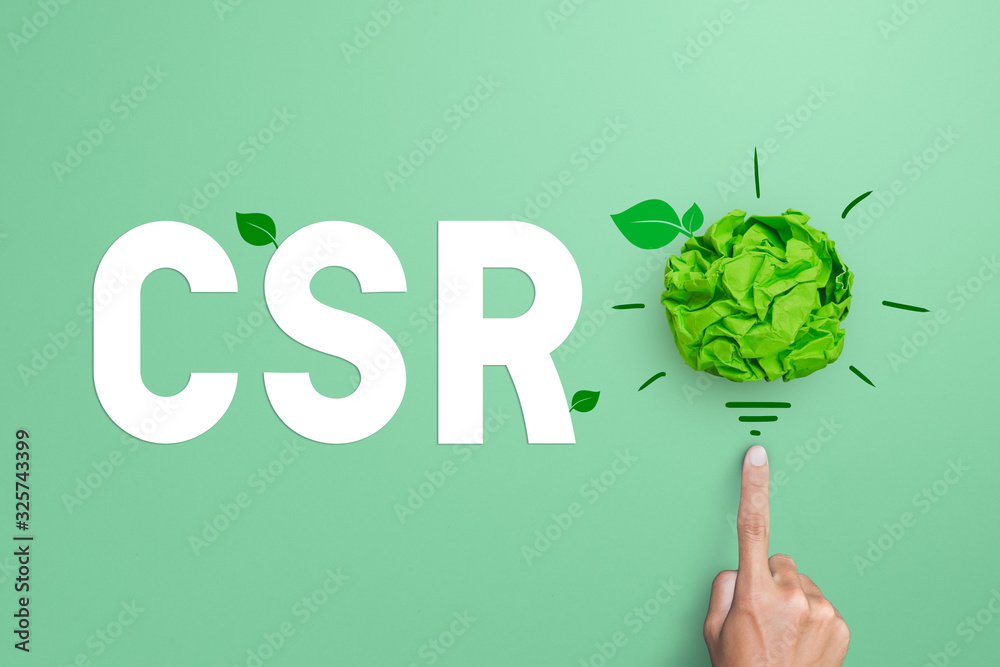 Corporate Social Responsibility (CSR) concept, Green crumpled paper ...