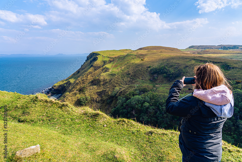 Female tourist taking photo of beautiful islands from view point on top ...
