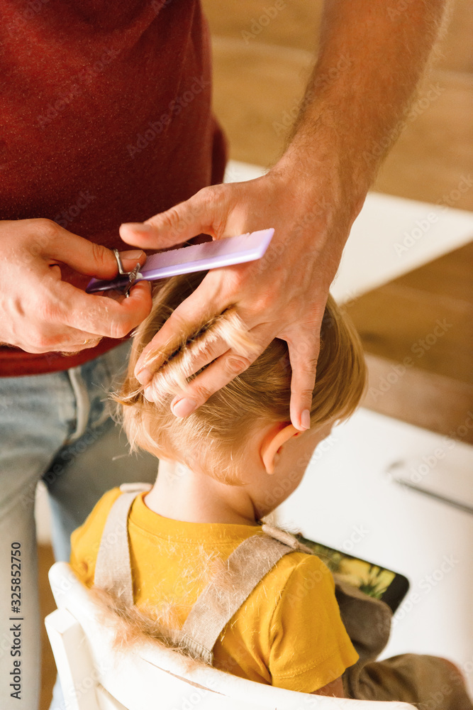 Dad cutting hair to little son Stock Photo | Adobe Stock