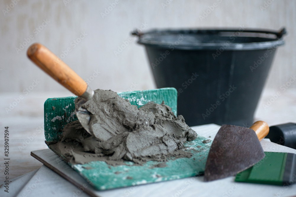 Cement or mortar with the trowel, Cement mix with the trowel at the ...