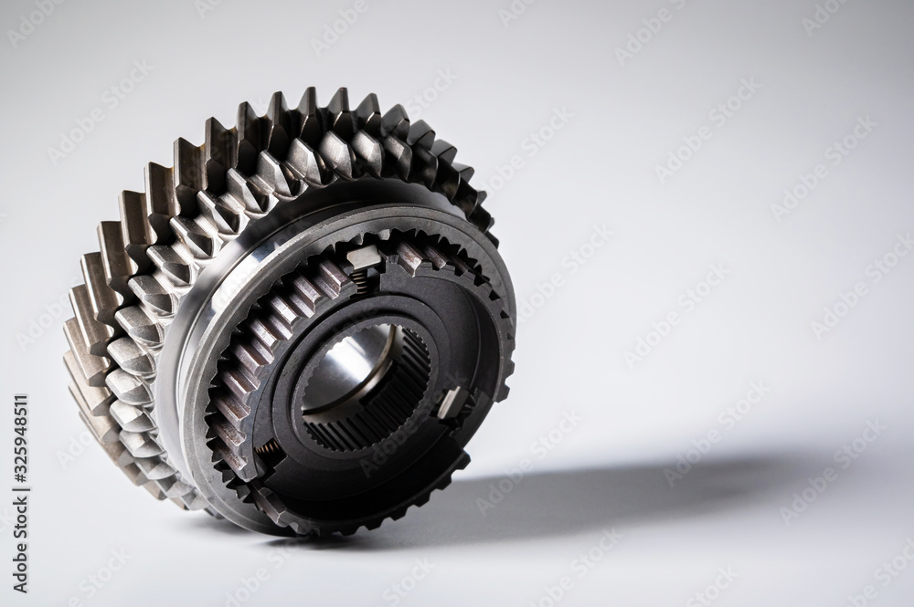 New parts on a gray background. Gears of gear shifting torque ...