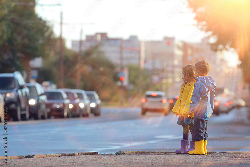 children cross the road / boy and girl small children in the city at ...