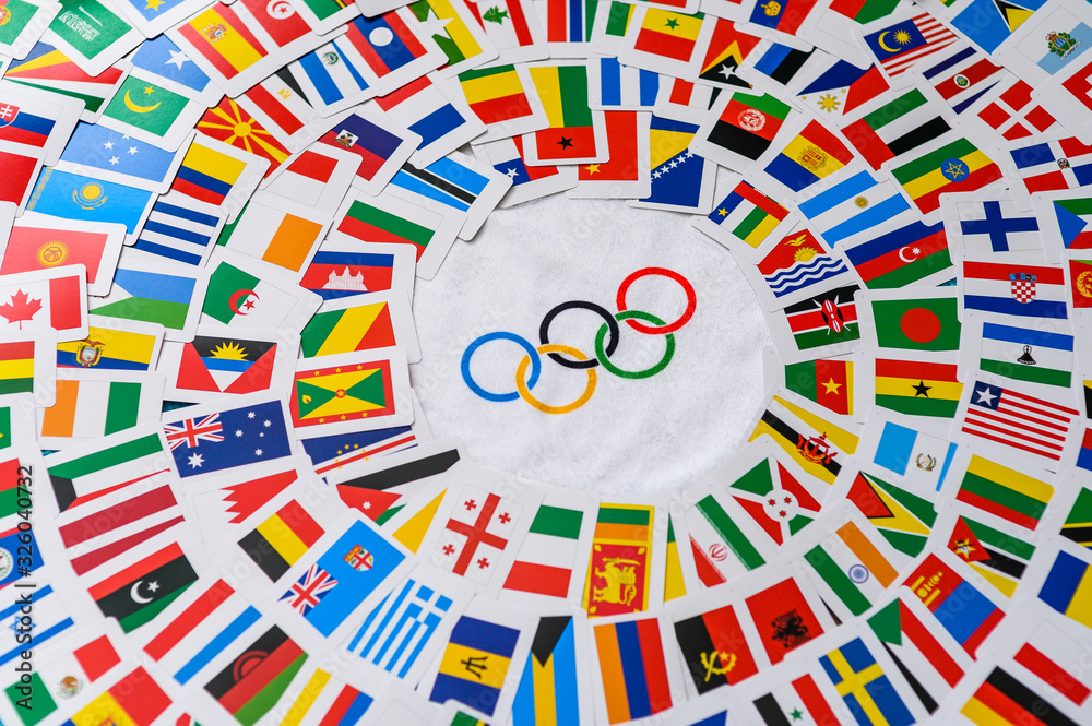 PARIS, FRANCE, FEBRUARY 25. 2020: Olympic rings and all world flags ...