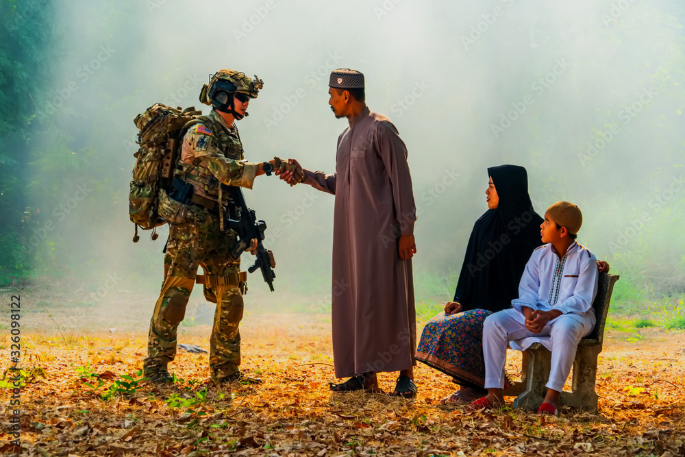Soldier man with Muslims family.Soldiers shaking hands with Muslims ...