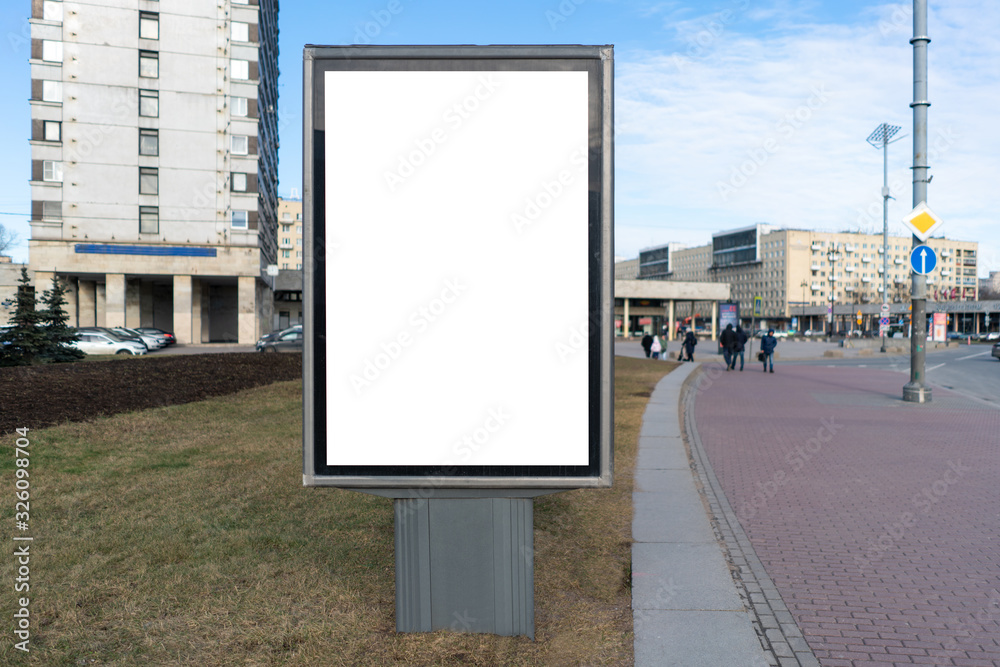 Vertical billboard, small city format. near the footpath. With white ...