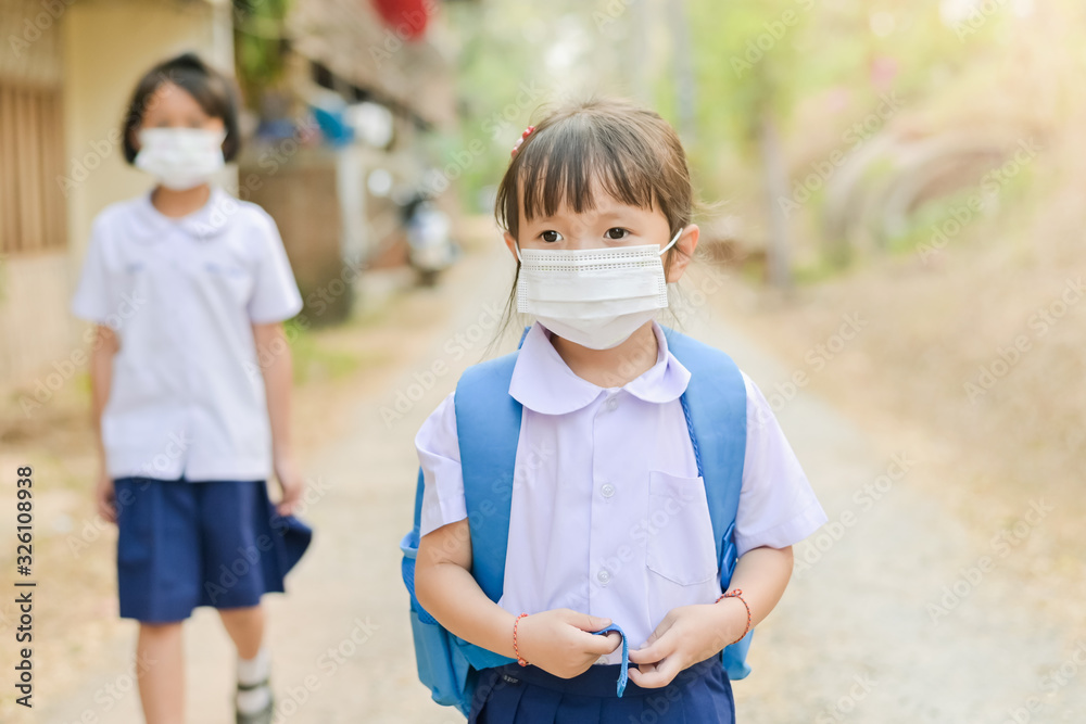 New Normal after COVID-19 outbreak,Little school girl has mask protect ...