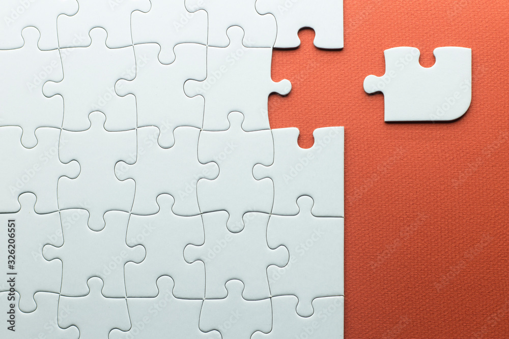 puzzle piece that does not fit with the others, white puzzle pieces on ...