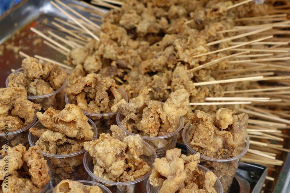 Fried crispy chicken skin and intestine sold as street food in the ...