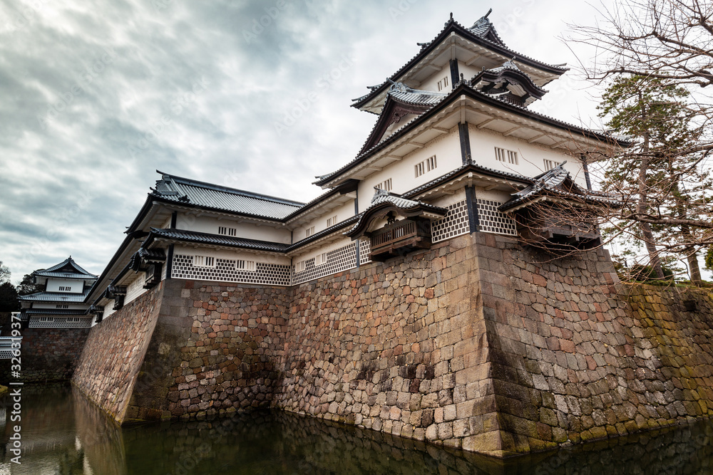 Kanazawa Castle over a dramatic winter sky showing the Hashizume-mon ...