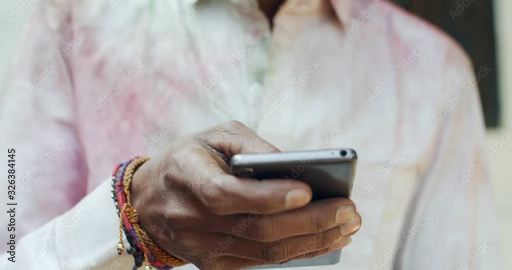 Indian man with black hair and beard, like guru yogi baba, using a ...