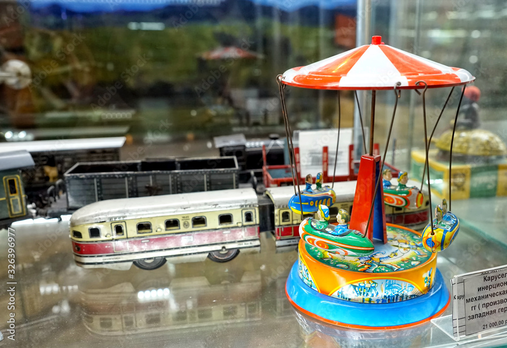 Mechanical carousel. Showcase with old toys in a retro toy store. Stock ...