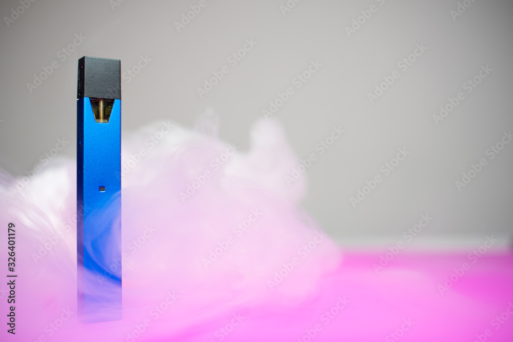 Blue Electric cigarette pod ( e cig ) Is a pen style. at the left side ...