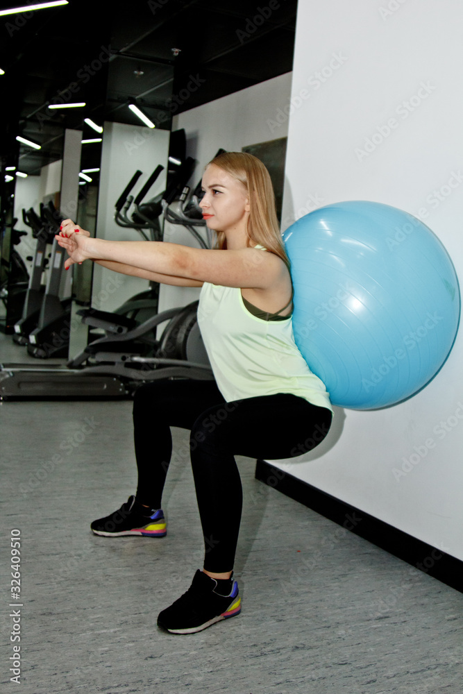Woman doing exercises with balance ball in the gym. Balance ball ...