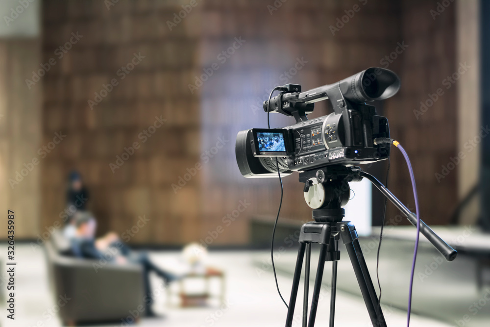 High definition movie recording video camera in a movie set with a news ...