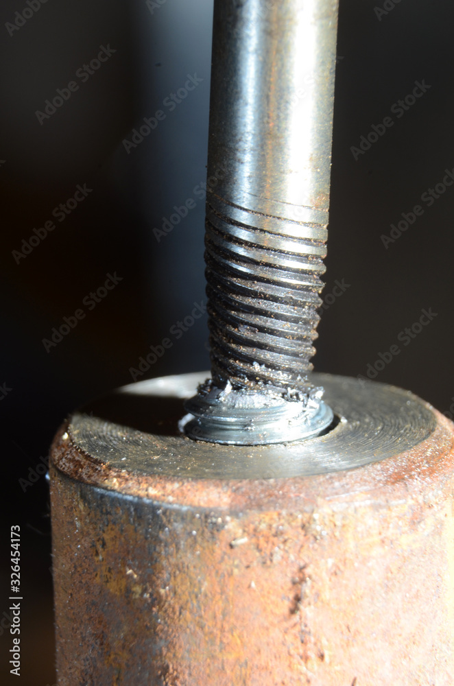 Tap extractor in use to remove the left-over stump of a broken bolt ...