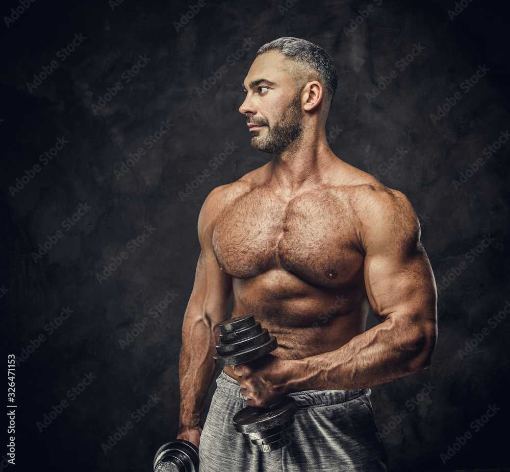 Strong, adult, fit muscular caucasian man coach posing for a photoshoot ...