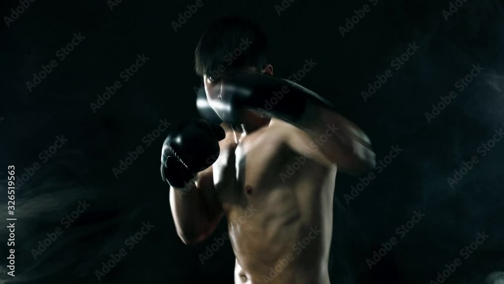 Shadow-boxing concept. Boxer man in gloves fighting with shadow on ...