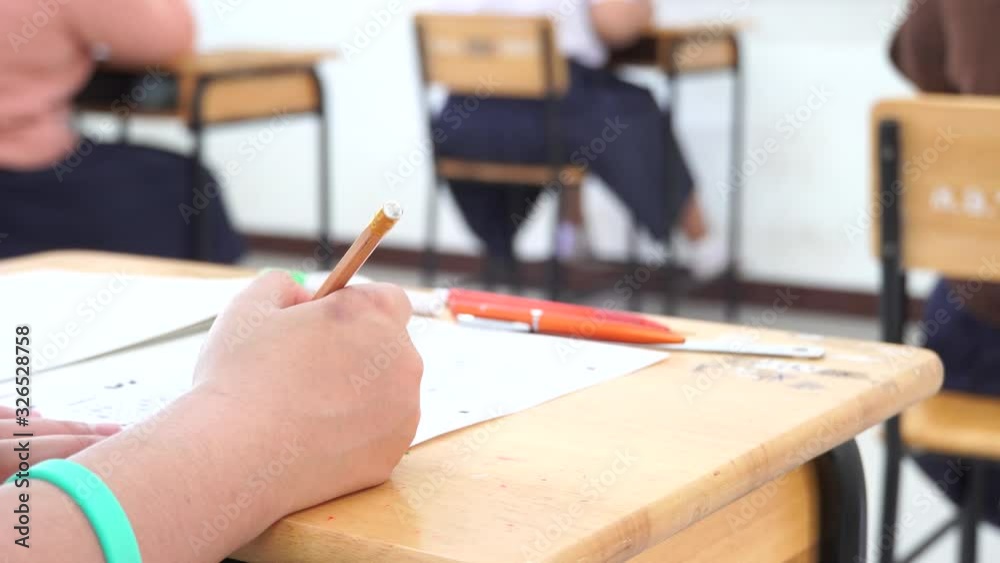Student hand testing doing test exam with pencil drawing selected ...