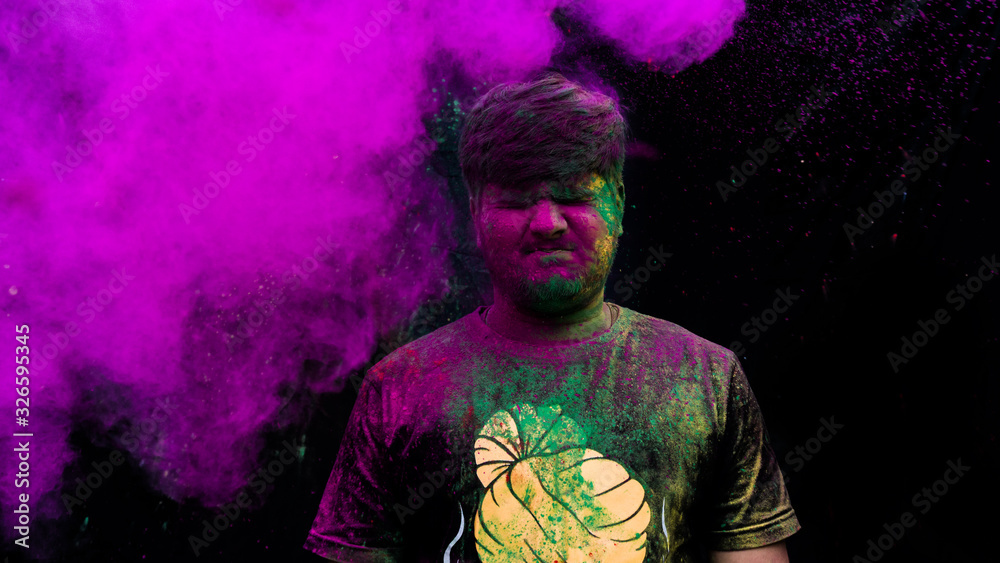 Young man celebrating holi with colors. holi is a festival of India. It ...