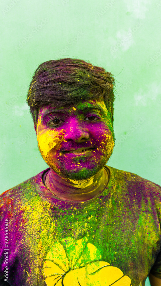 Young man celebrating holi with colors. holi is a festival of India. It ...